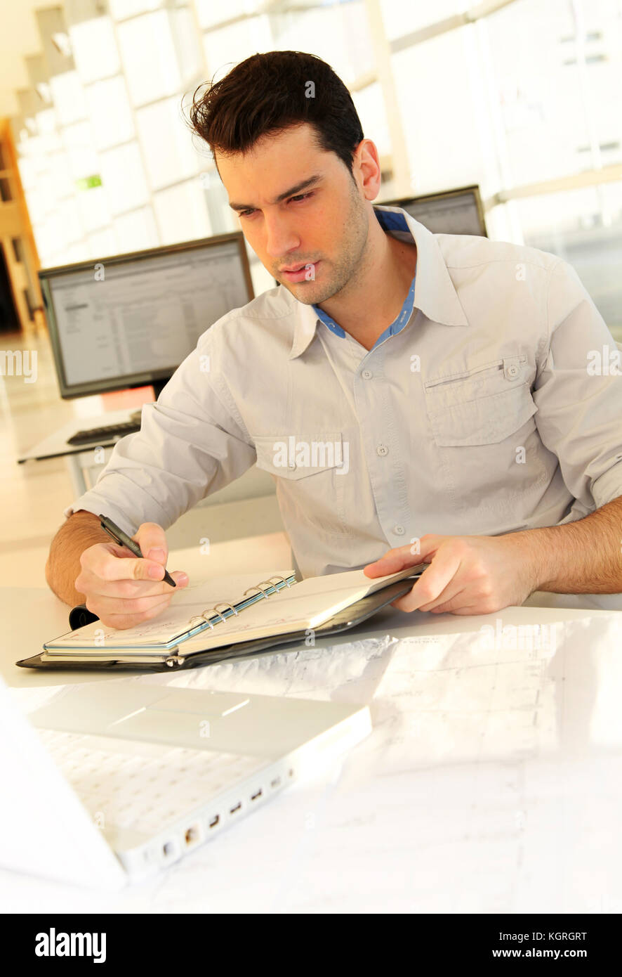 Young man studying at university Stock Photo - Alamy