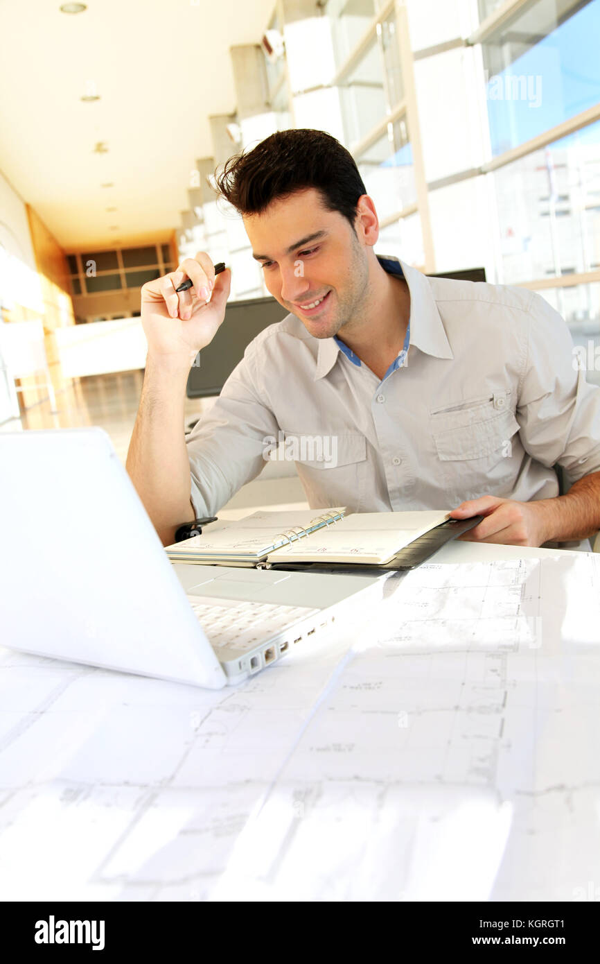 Young man studying at university Stock Photo - Alamy