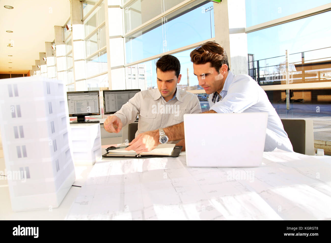 Young architects working on project Stock Photo - Alamy