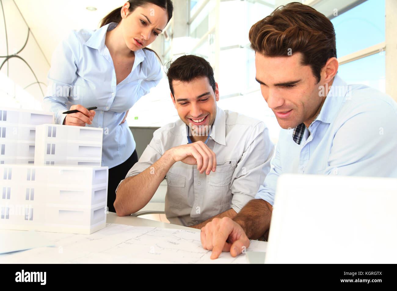Team of architects working on project Stock Photo - Alamy