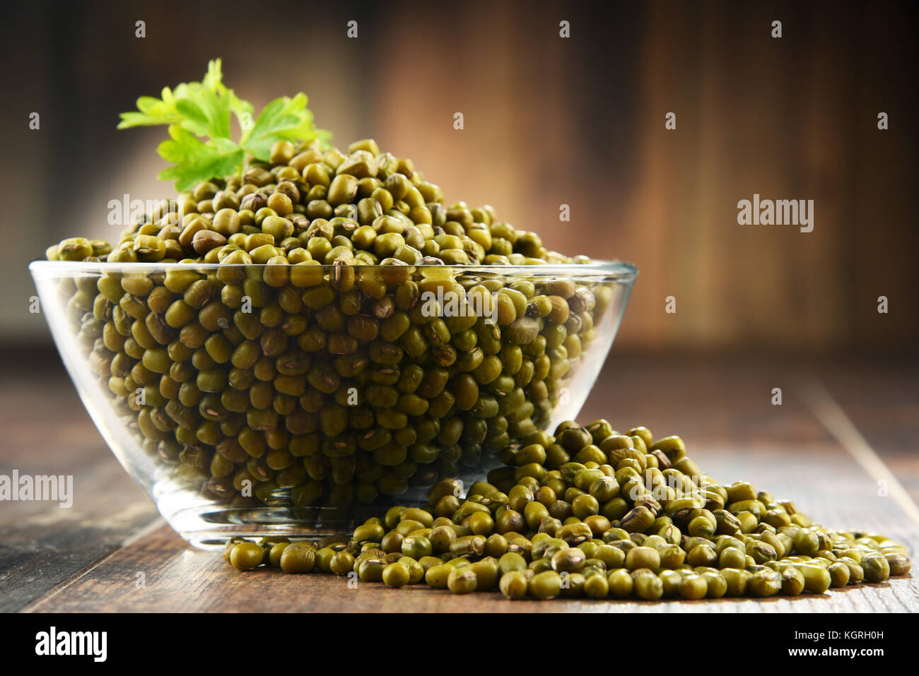 Composition with bowl of vigna mungo bean on wooden table Stock Photo ...