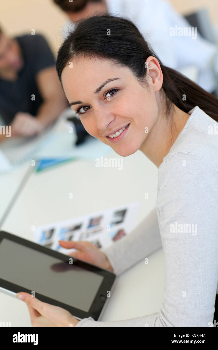 Young smiling woman with electronic tablet Stock Photo - Alamy