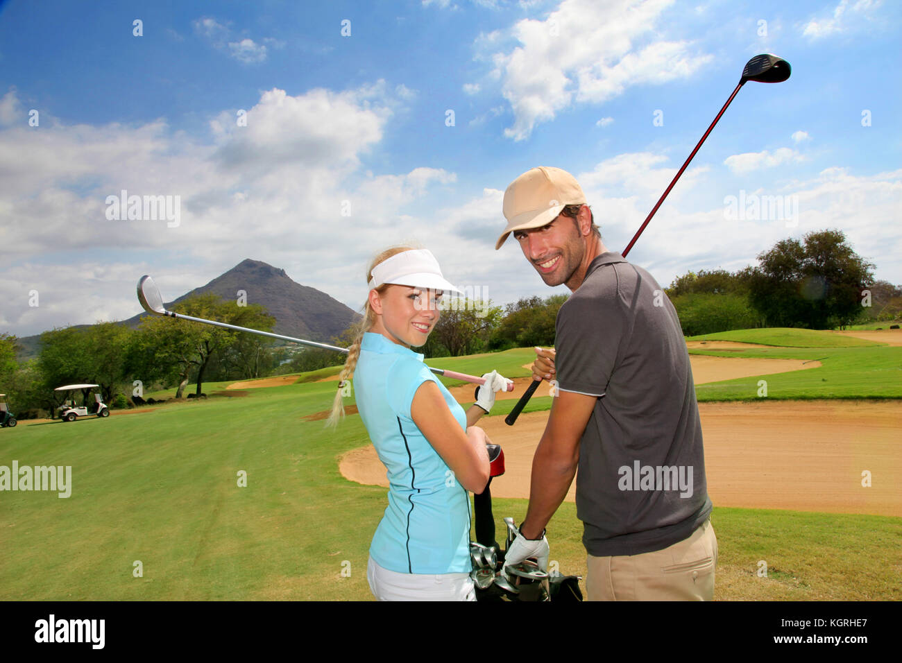 Golfers on golf course Stock Photo - Alamy