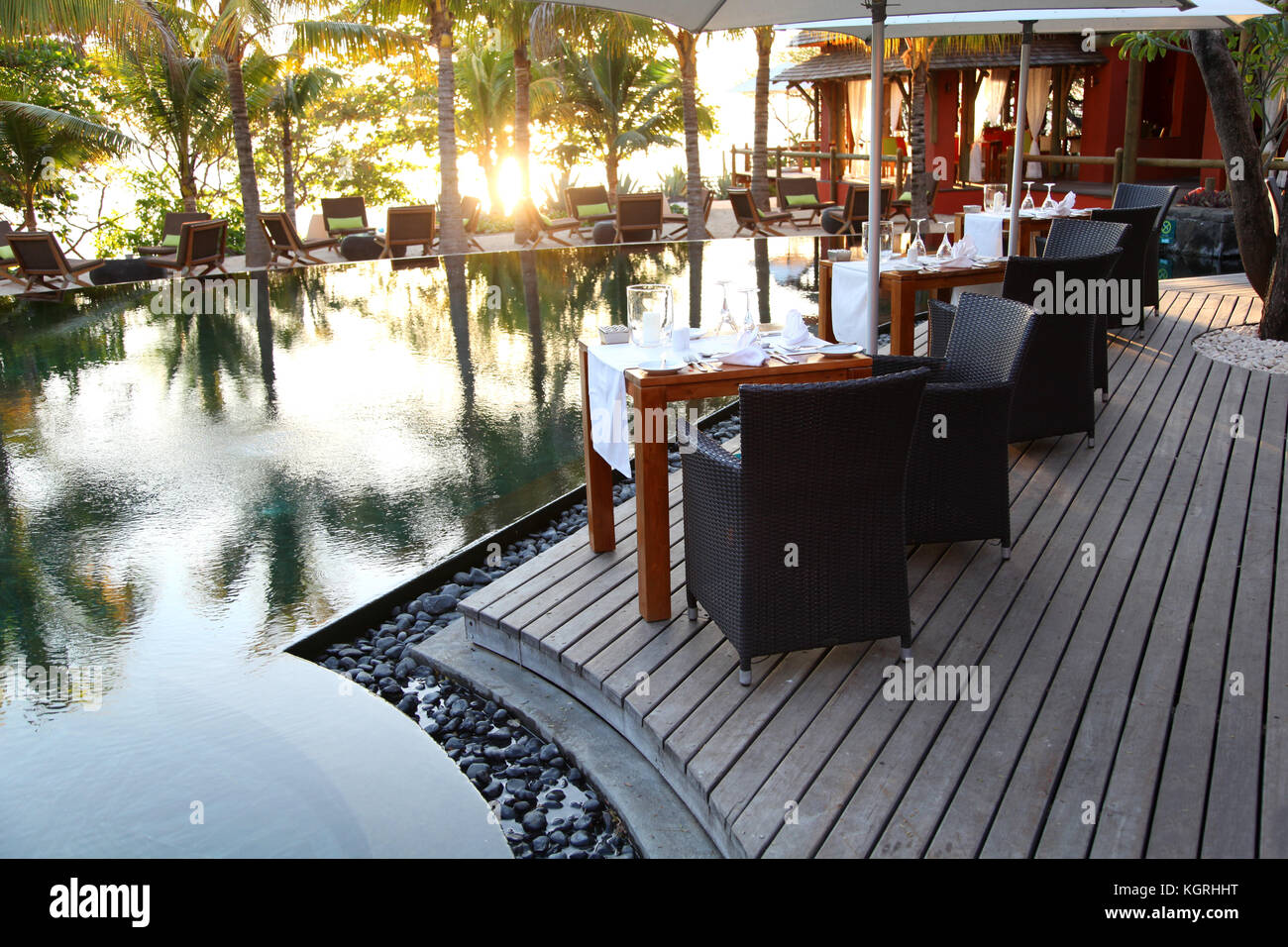 View of resort restaurant terrace and pool Stock Photo - Alamy