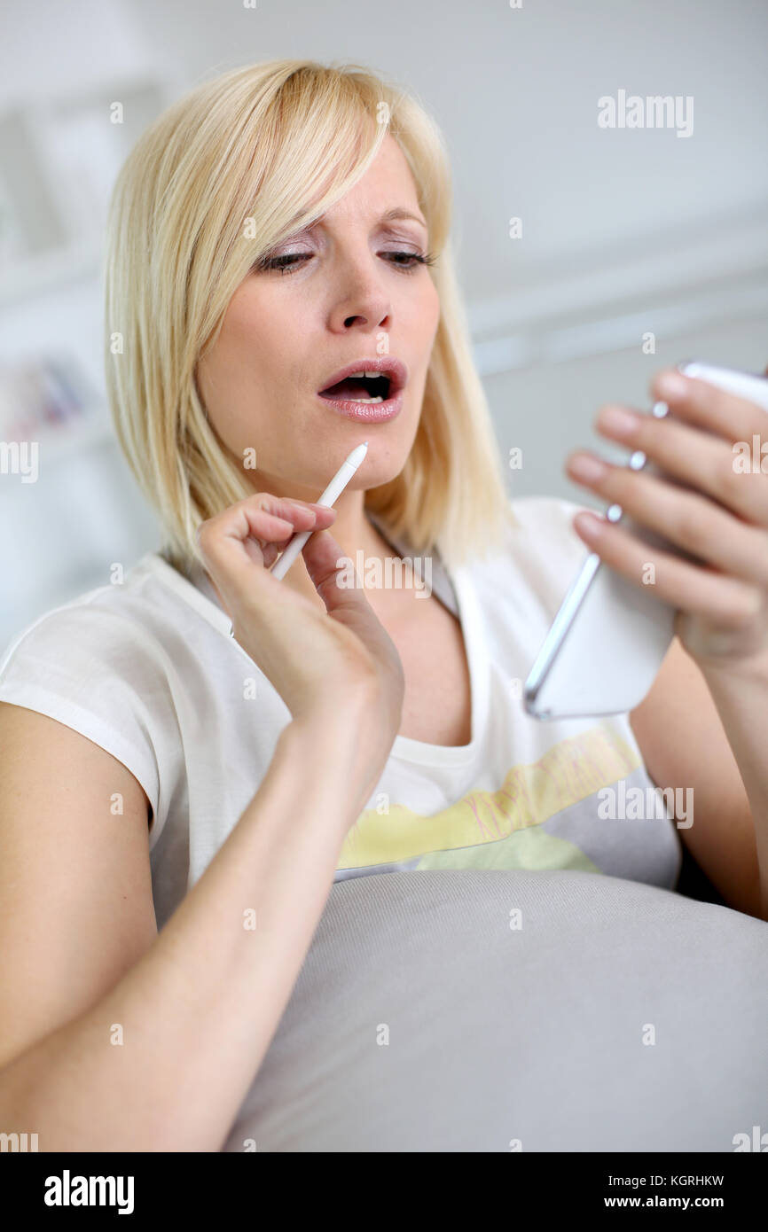 Cheerful girl using smartphone hi-res stock photography and images - Alamy