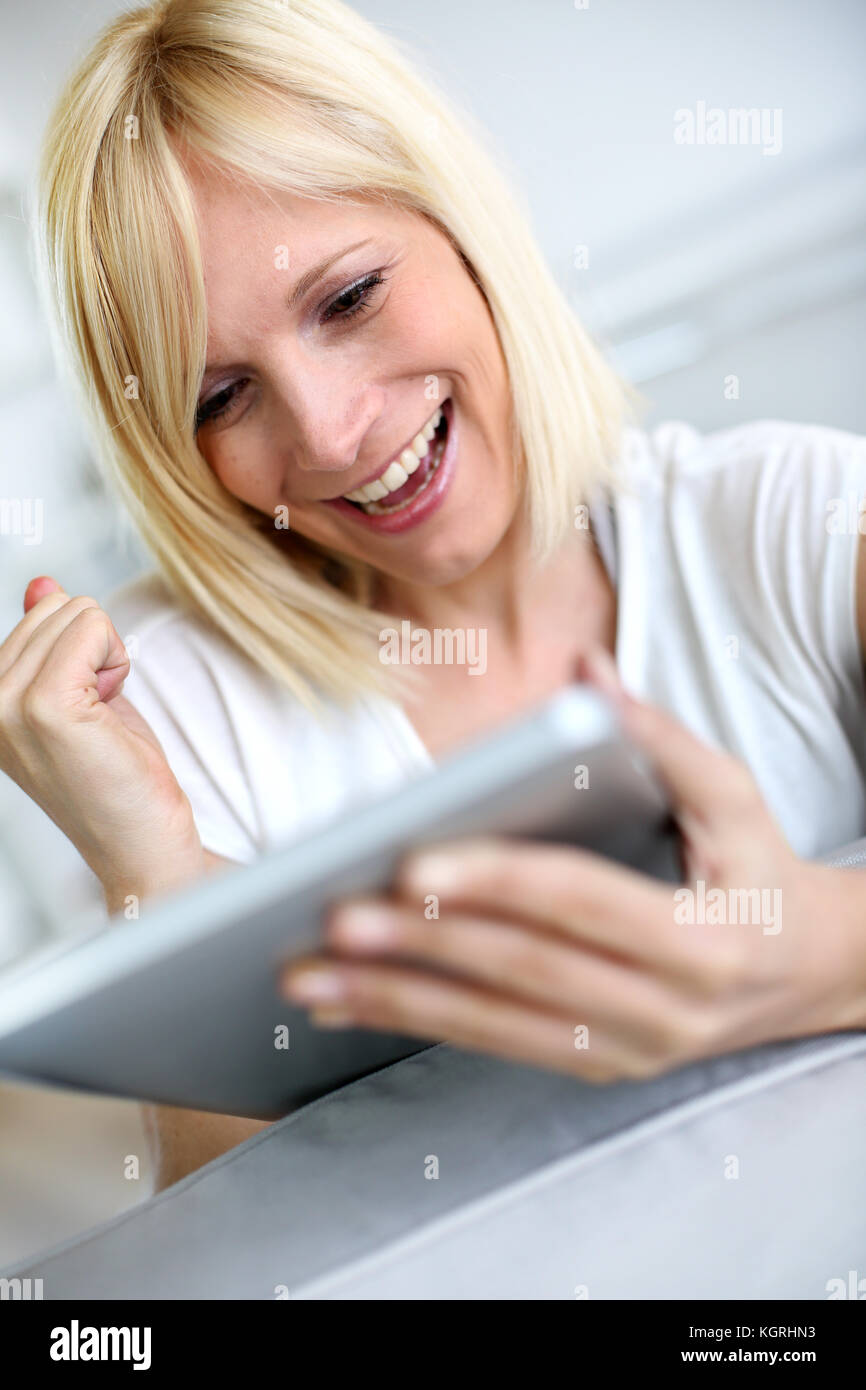 Beautiful young woman with satisfied expression Stock Photo - Alamy