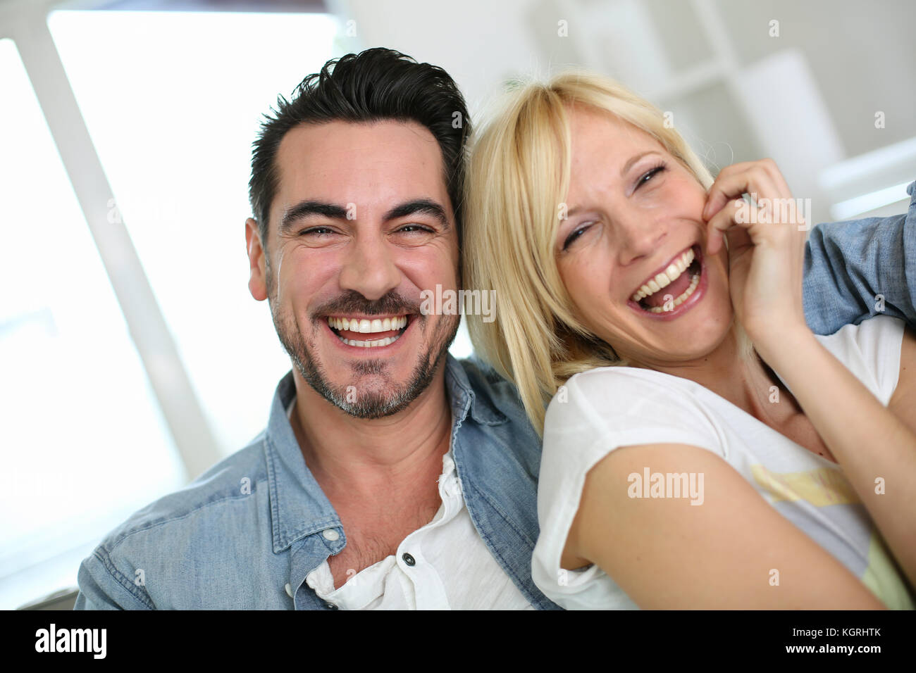 Cheerful couple having fun Stock Photo - Alamy