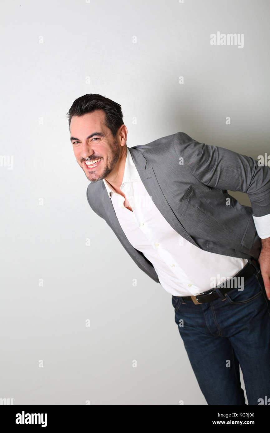 Middle-aged man standing on white background Stock Photo - Alamy