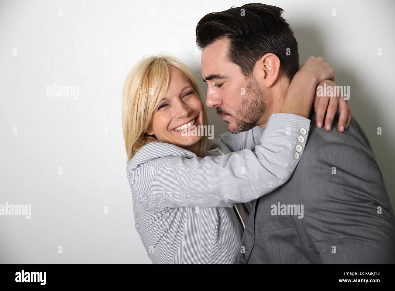 Trendy loving couple on white background Stock Photo - Alamy
