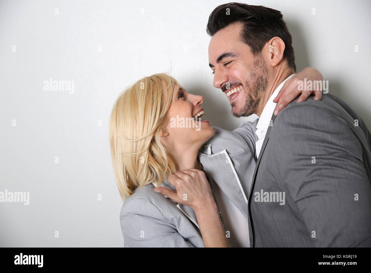 Trendy loving couple on white background Stock Photo - Alamy