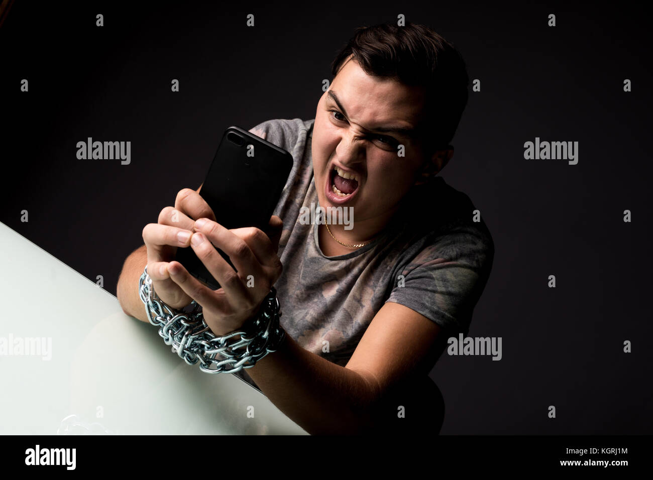 Man suffering from phone dependence addiction in dark room Stock Photo ...