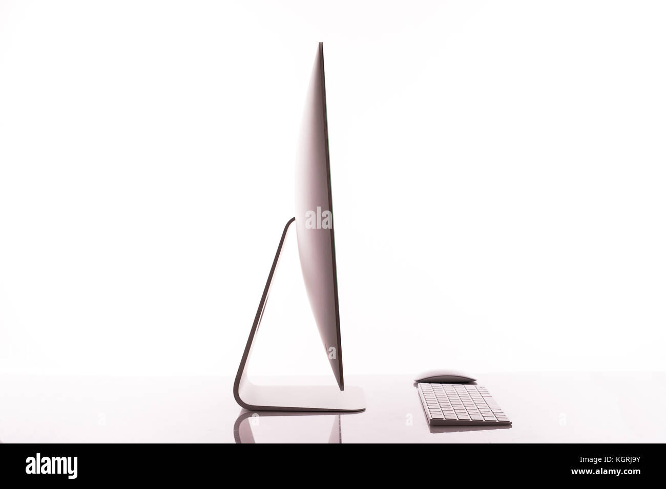 Keyboard and computer screen on a white table with reflection Stock ...