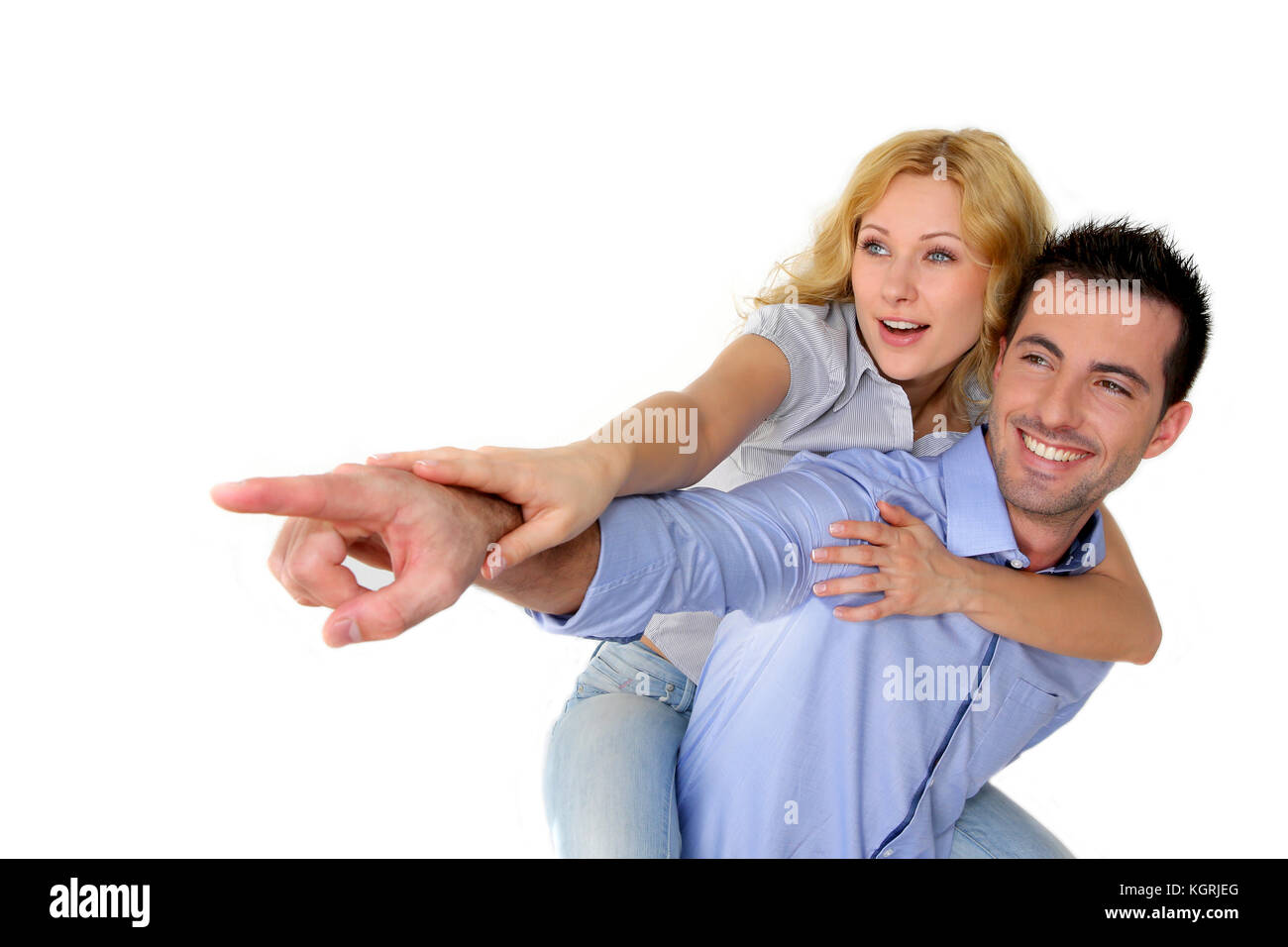 Cheerful couple pointing at one side Stock Photo - Alamy