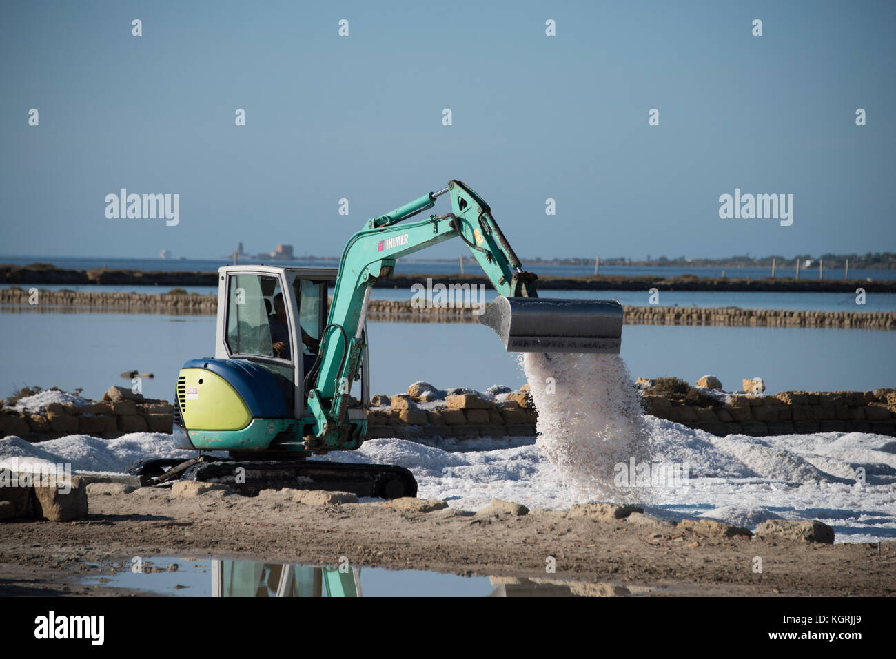 Excavators digging salt from a salt pool, Motya, Marsala, Sicily Stock ...