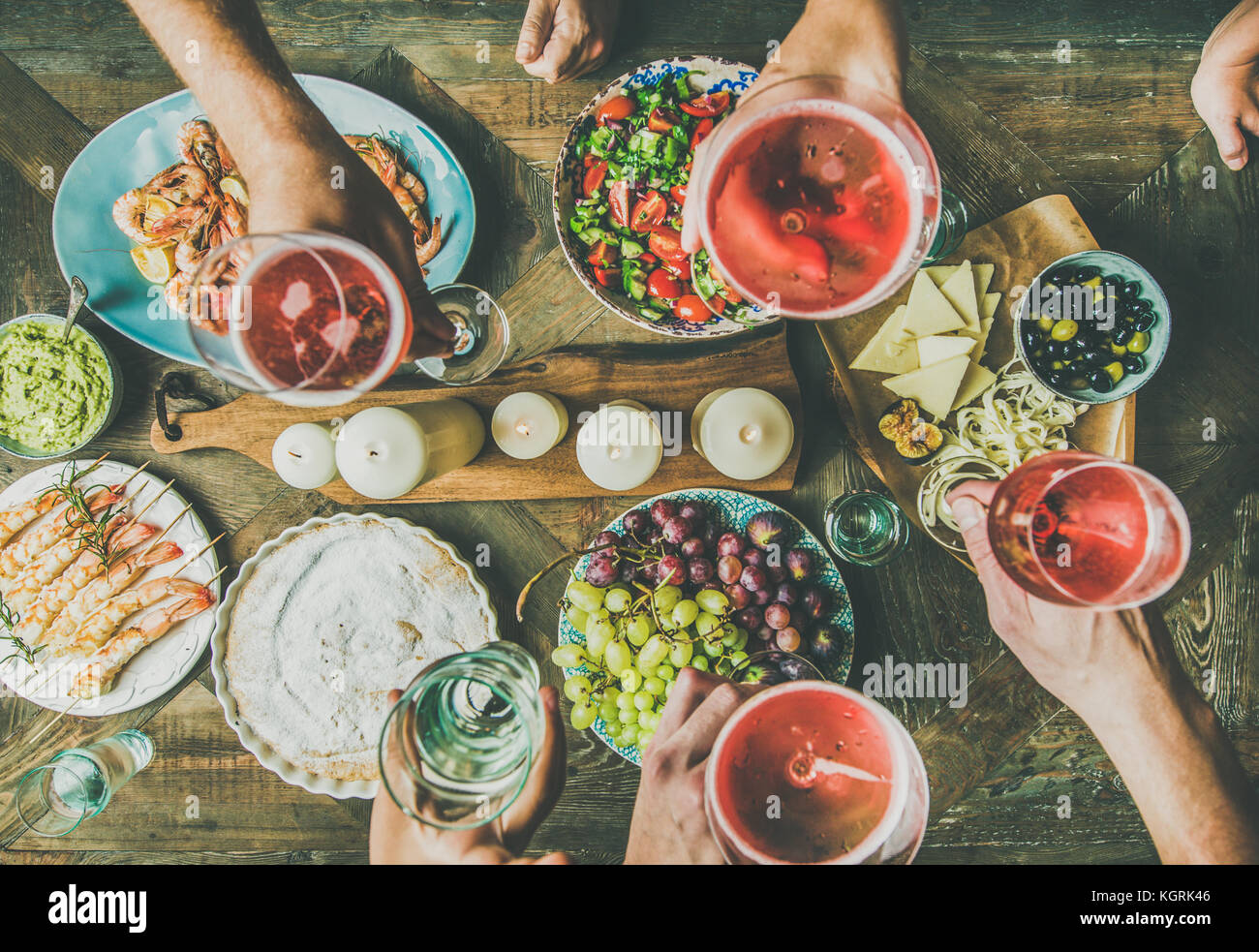 Holiday celebration table setting with wine snacks. Flat-lay of friends ...