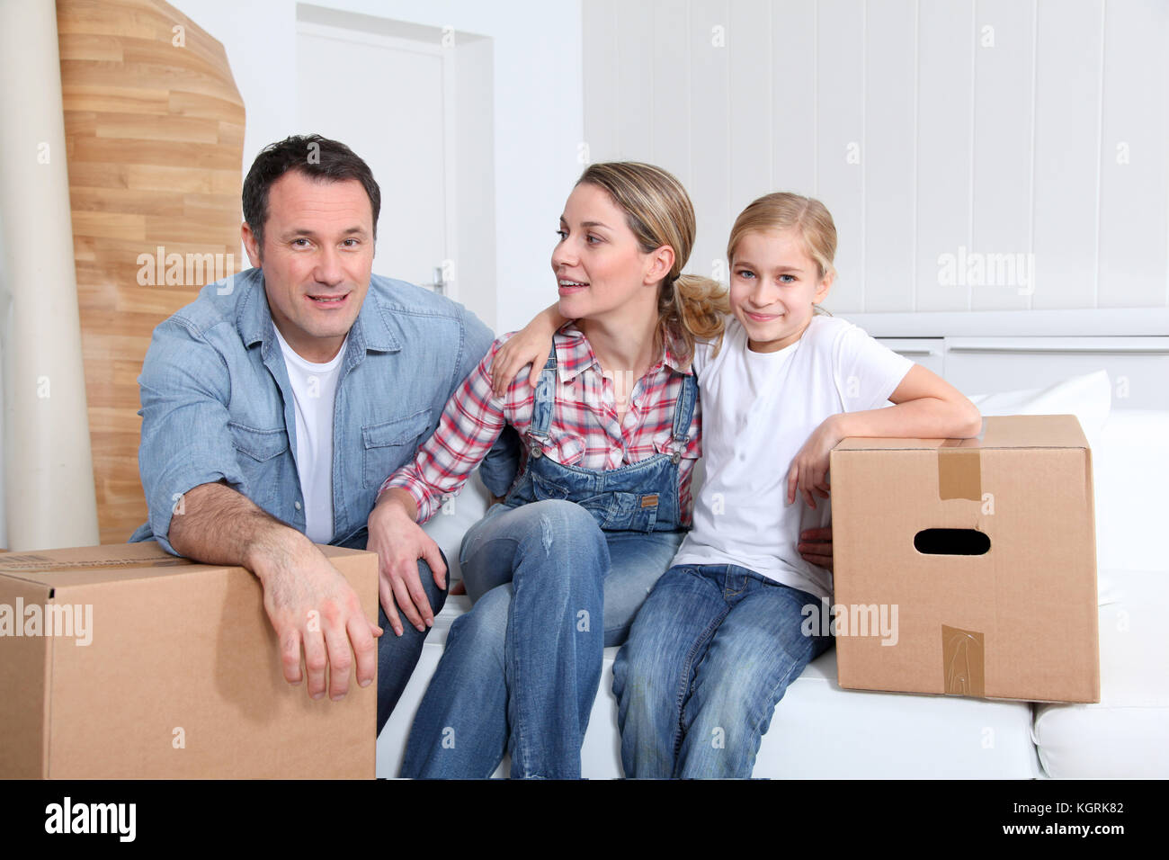 Happy family moving in new house Stock Photo - Alamy