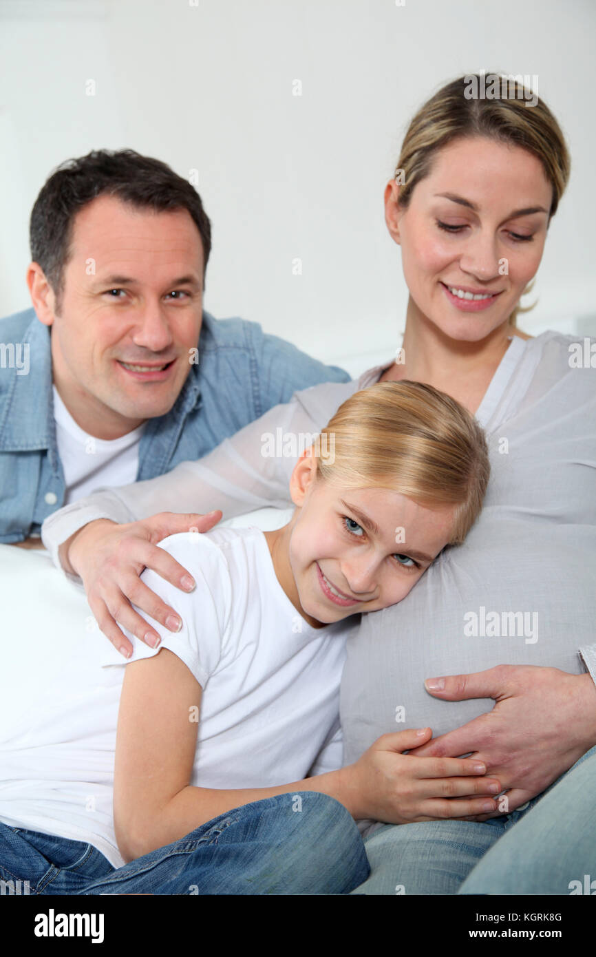Portrait of family expecting new baby to come Stock Photo - Alamy