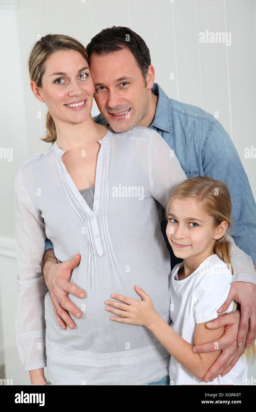 Portrait of family expecting new baby to come Stock Photo - Alamy