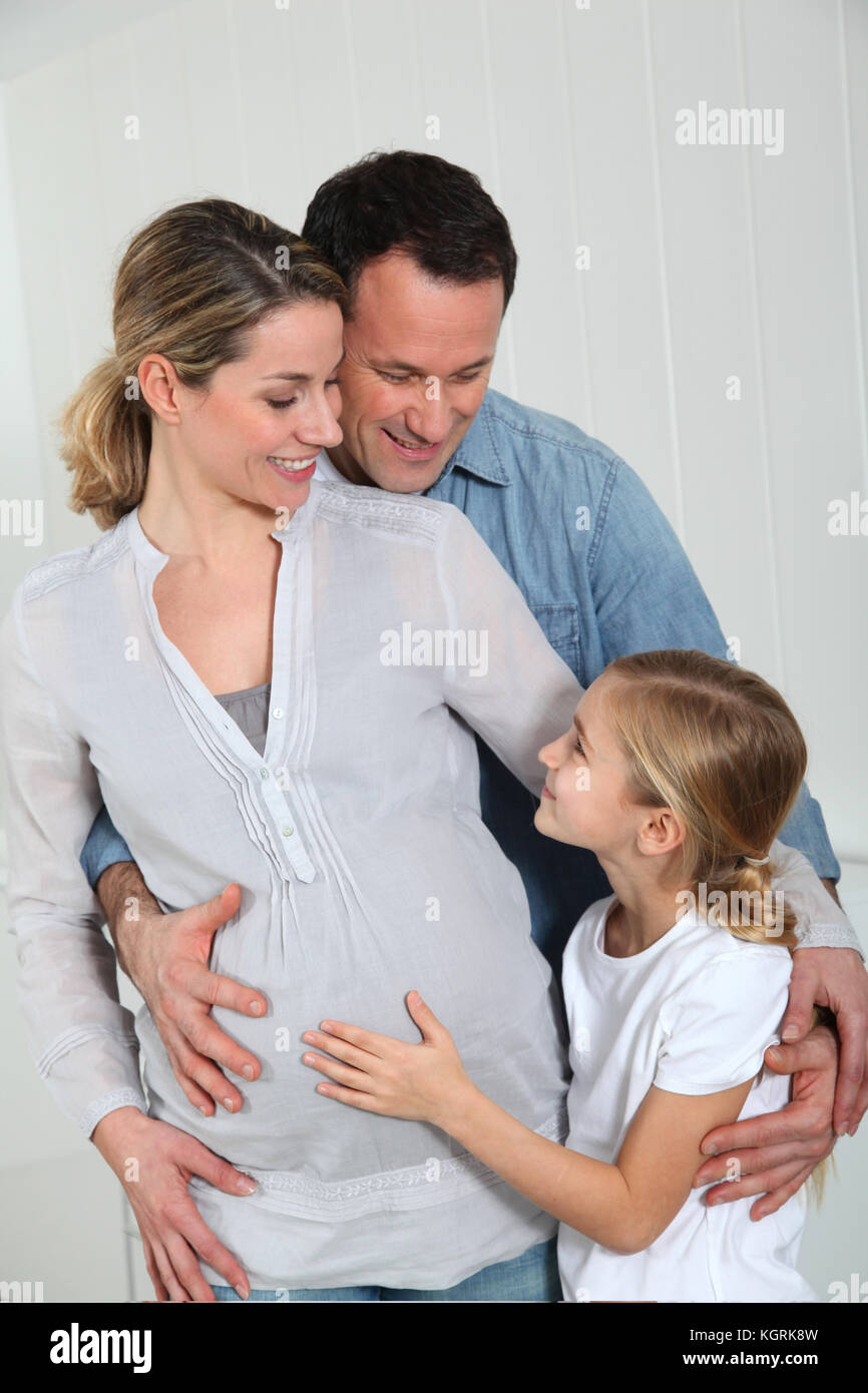 Portrait of family expecting new baby to come Stock Photo - Alamy