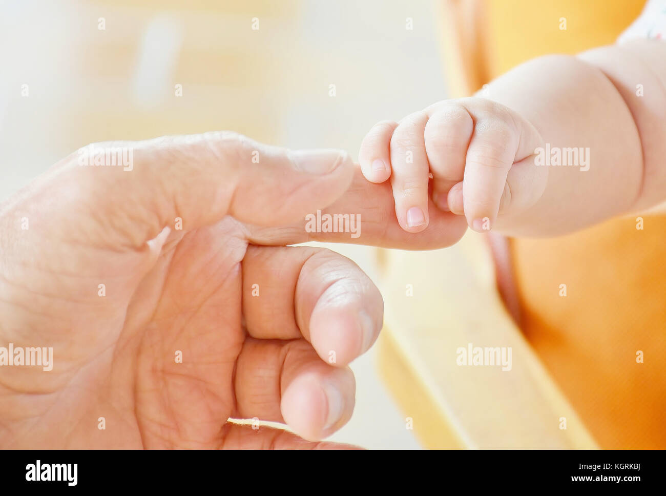 baby holding father hand Stock Photo - Alamy