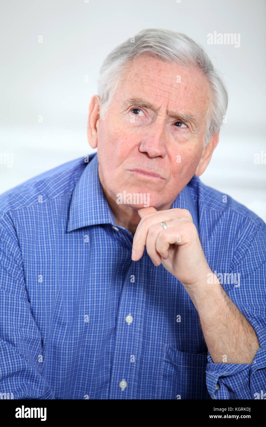 Portrait of smiling old man with thoughtful look Stock Photo - Alamy