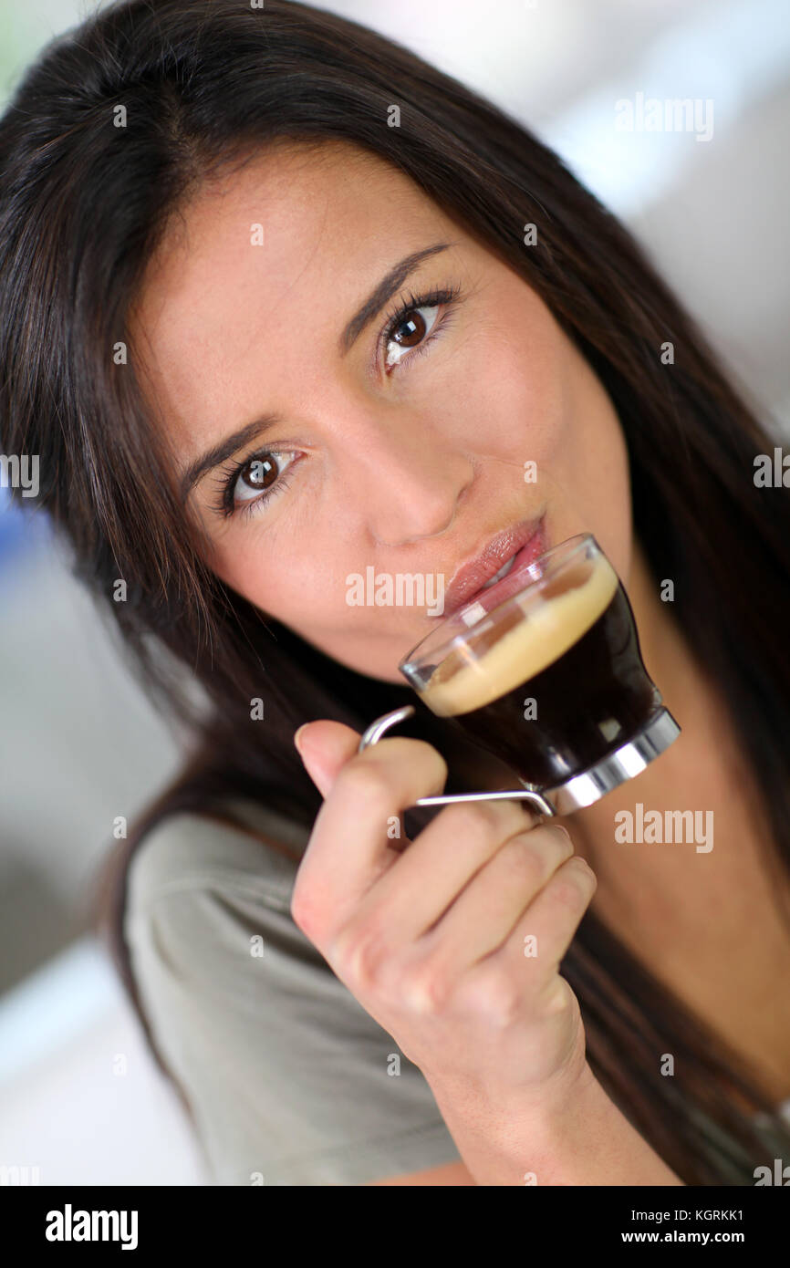 Portrait of beautiful woman drinking expresso Stock Photo - Alamy