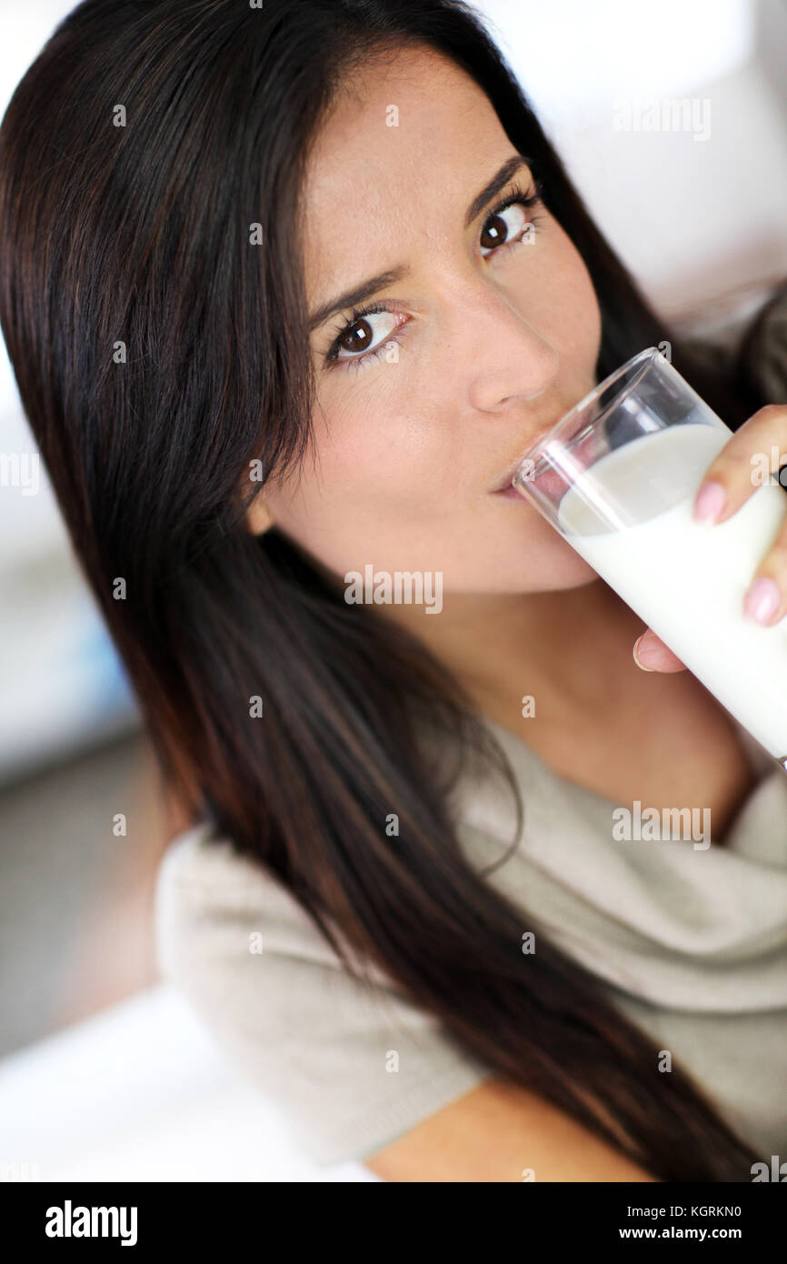 Smiling model drinking glass milk hi-res stock photography and images ...