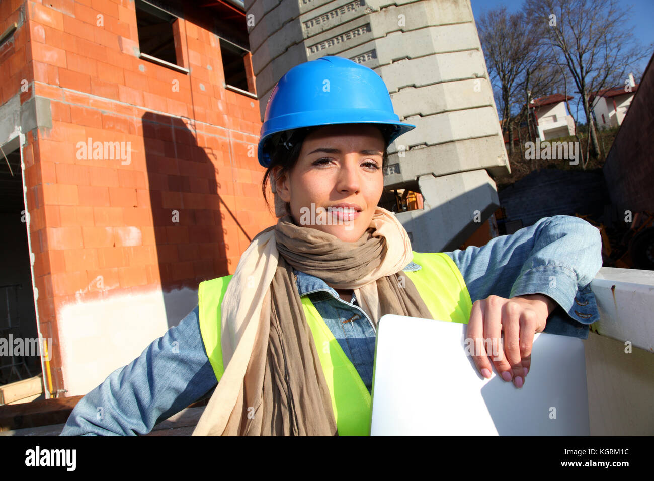Architect on building site using electronic tablet Stock Photo - Alamy