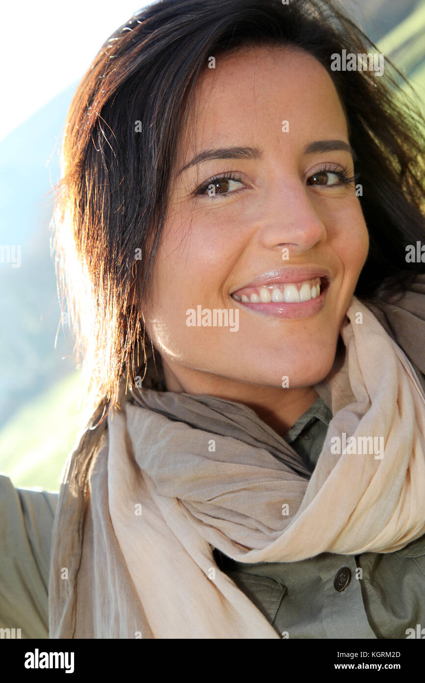 Portrait of young woman in country field Stock Photo - Alamy
