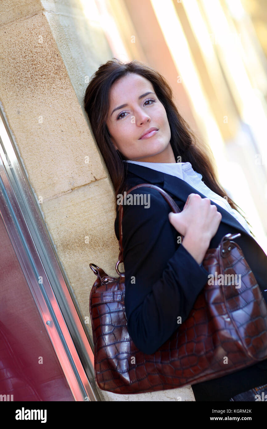 Young woman walking in town Stock Photo - Alamy
