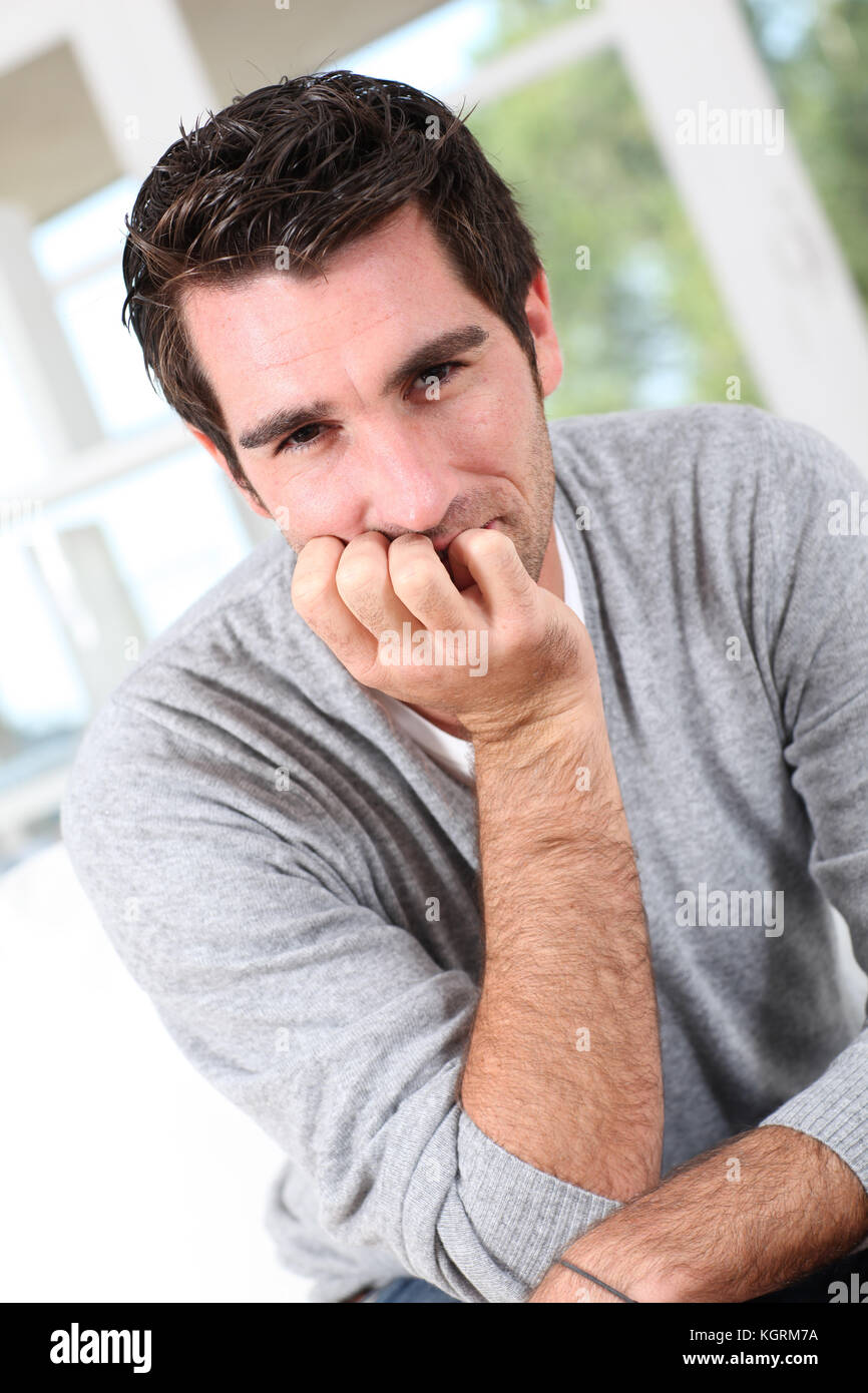 Portrait of skeptical man Stock Photo - Alamy