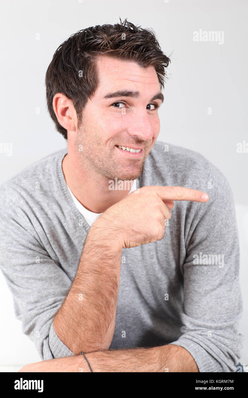 Portrait of handsome man pointing at camera Stock Photo - Alamy