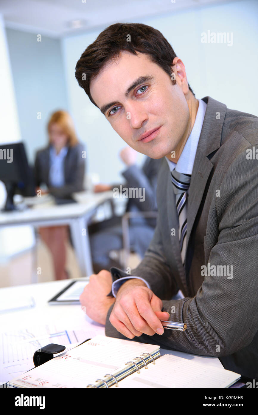 Portrait of businessman in office Stock Photo - Alamy