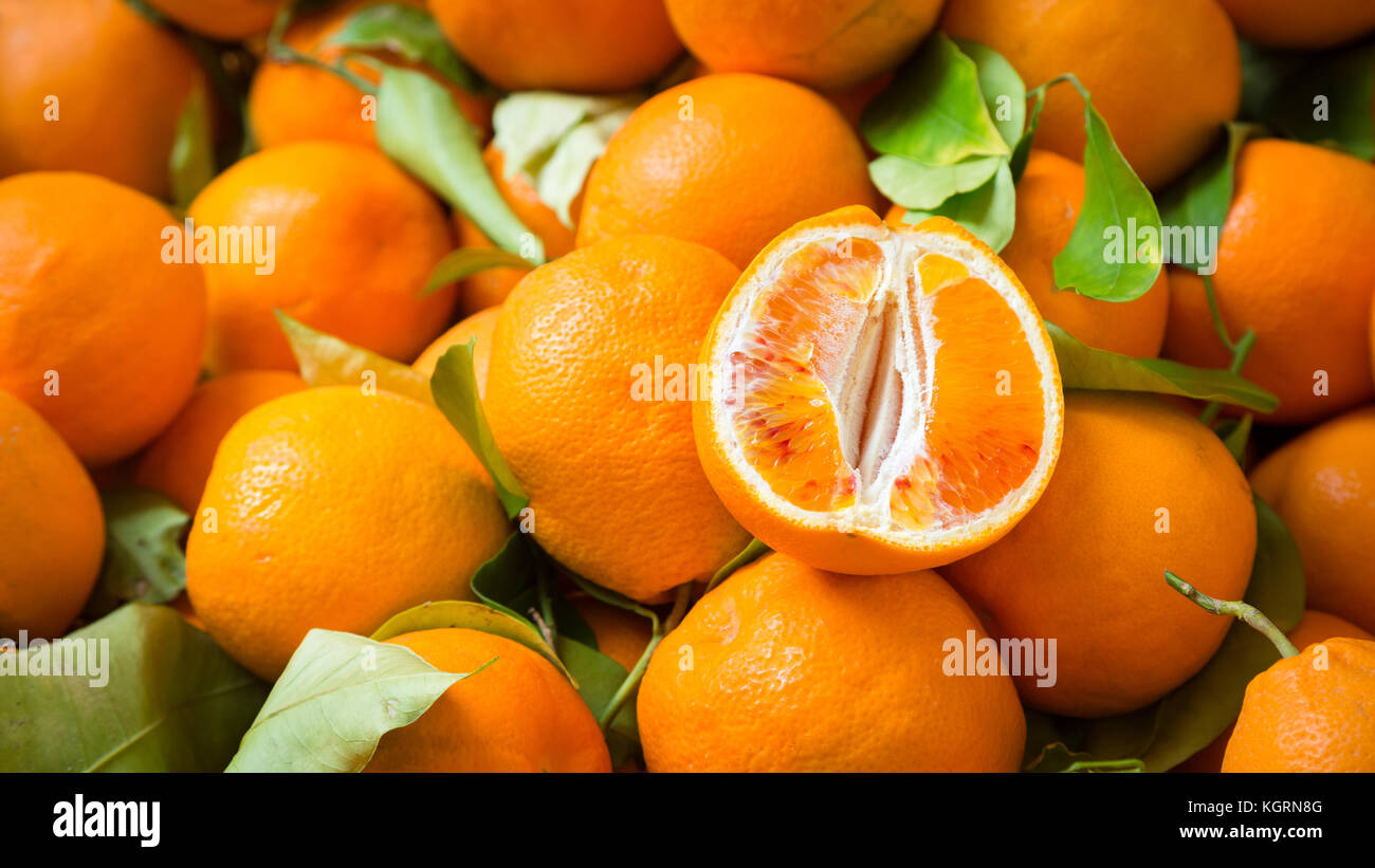 Fresh juicy oranges background Stock Photo - Alamy