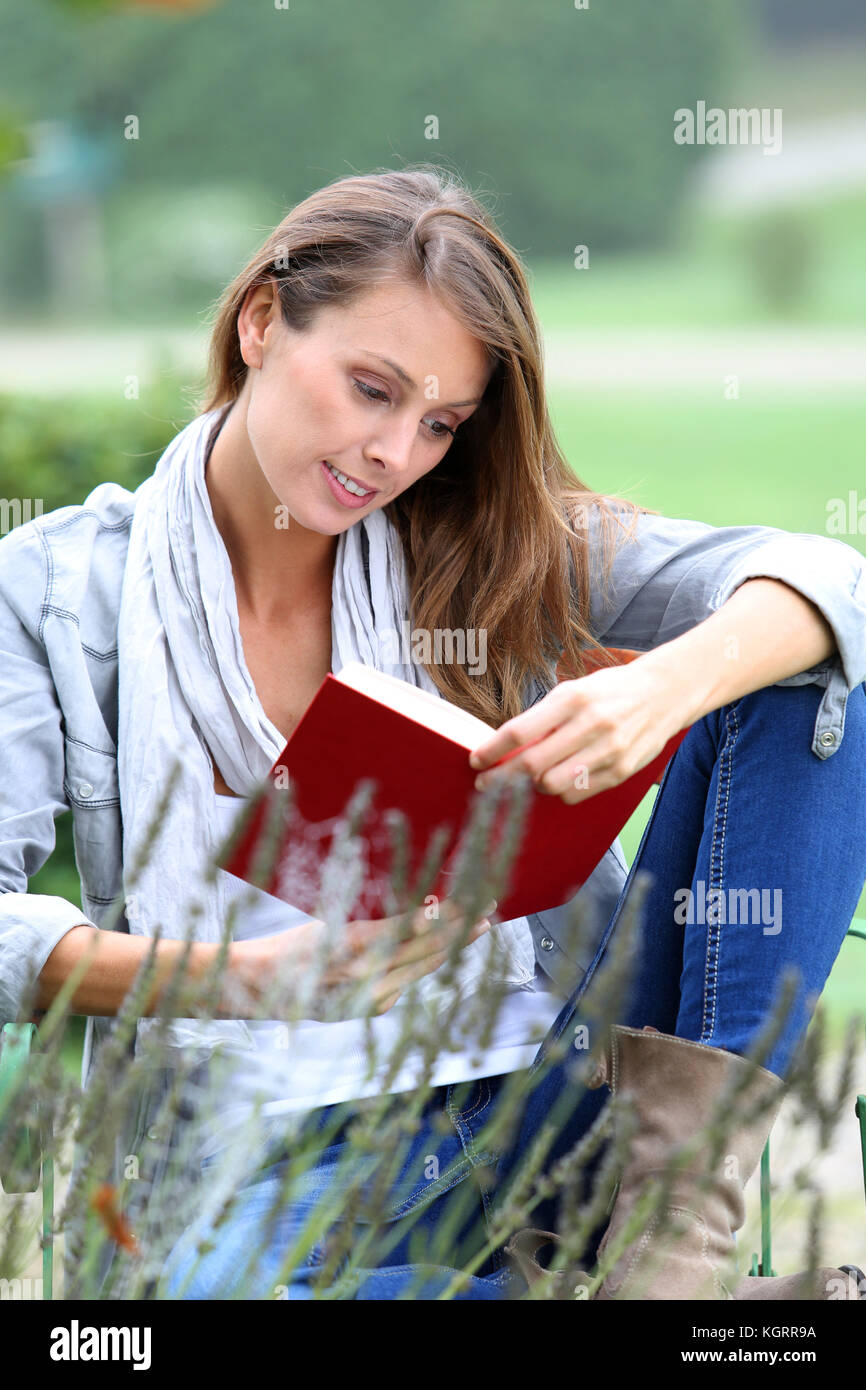 Portrait of beautiful woman reading book in nature Stock Photo - Alamy