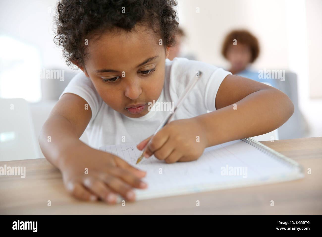 Portrait of little boy drawing with pen Stock Photo - Alamy