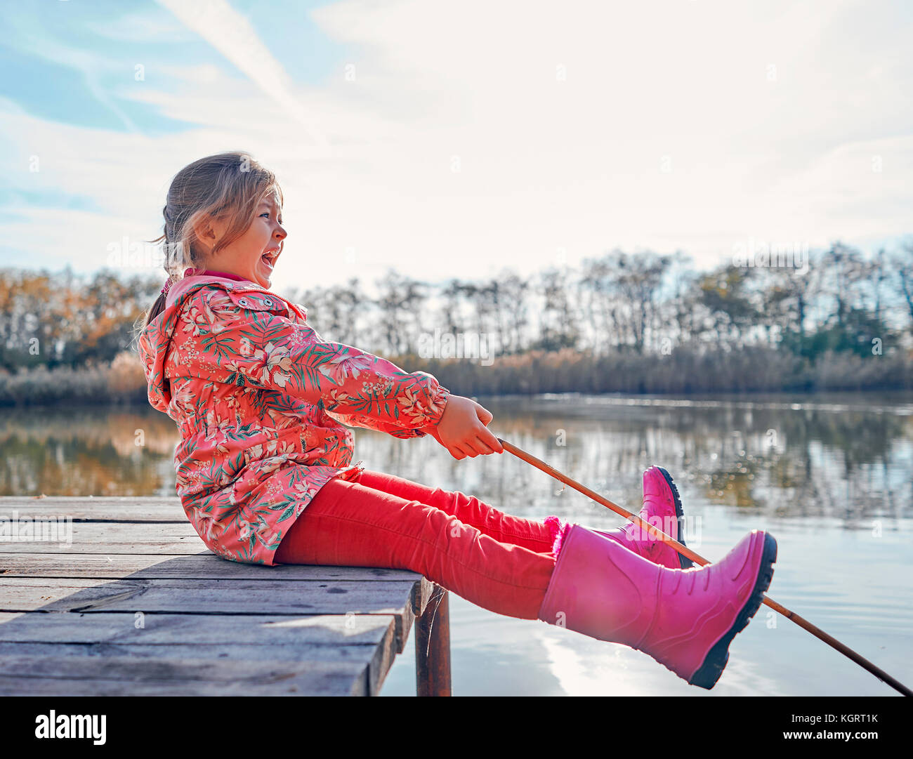 little girl fishing on the river Stock Photo - Alamy