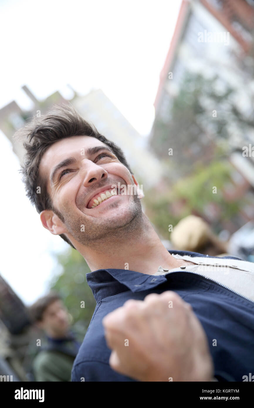 Man expressing happiness and success in the street Stock Photo - Alamy