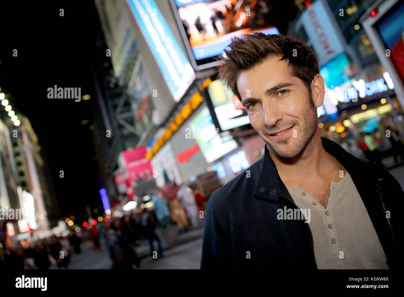 Man standing in Time Square on Broadway street Stock Photo - Alamy