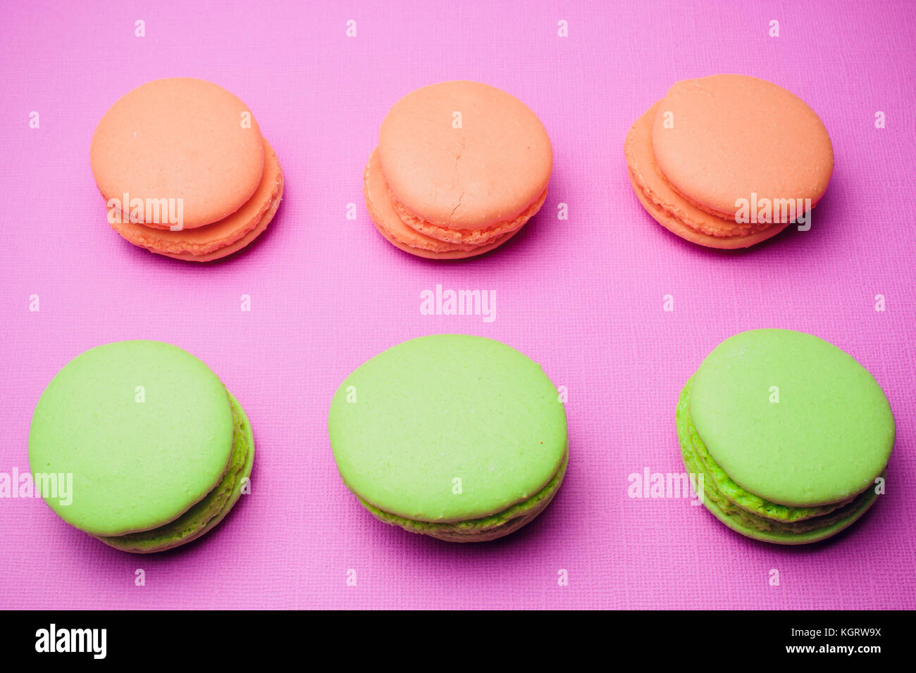 six makaruni on a colored background sweetness green Stock Photo - Alamy