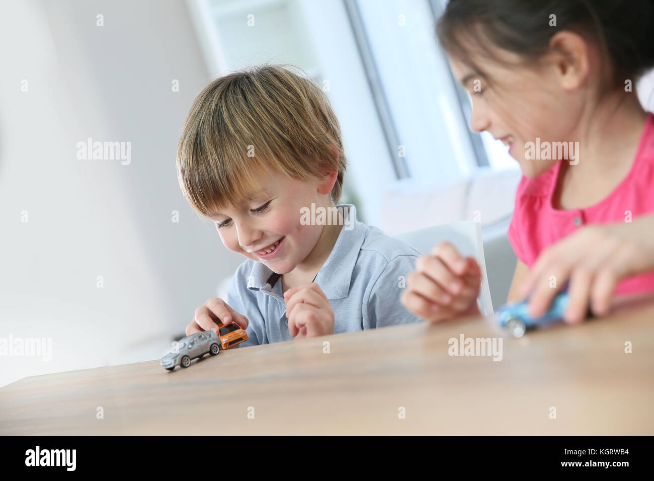 Kids playing with toy cars at home Stock Photo - Alamy