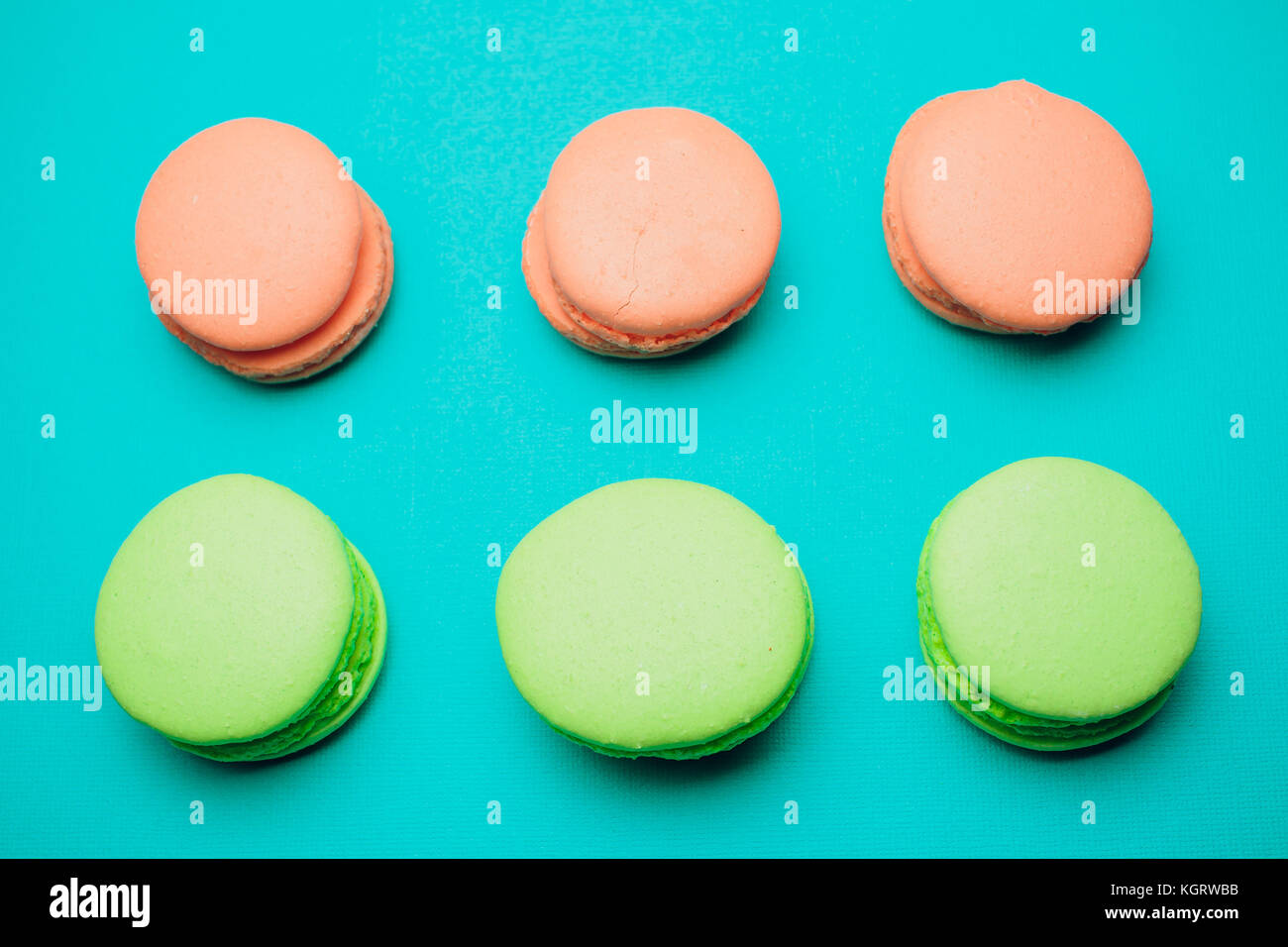 six makaruni on a colored background sweetness green Stock Photo - Alamy