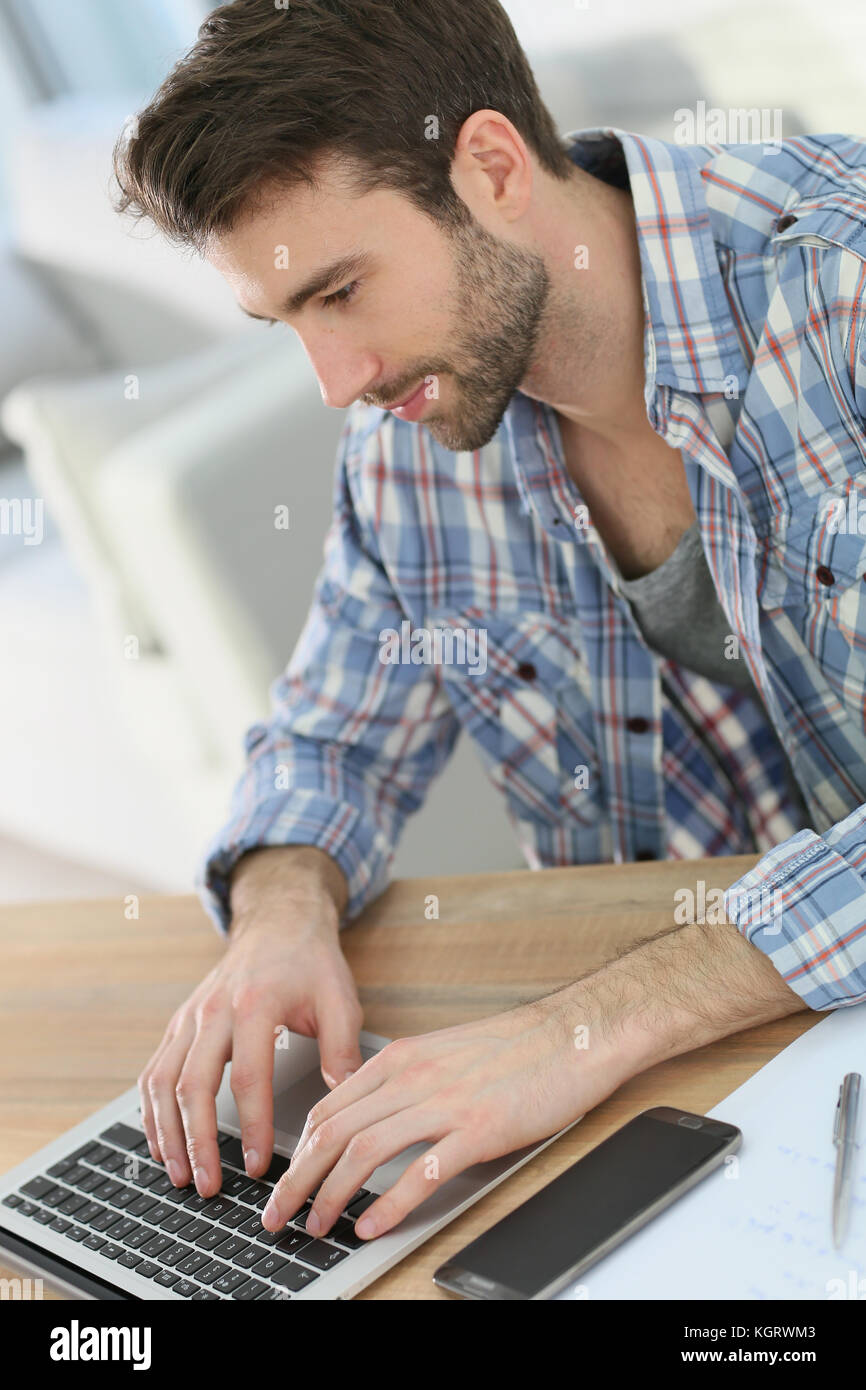 Portrait of smiling home-office worker Stock Photo - Alamy