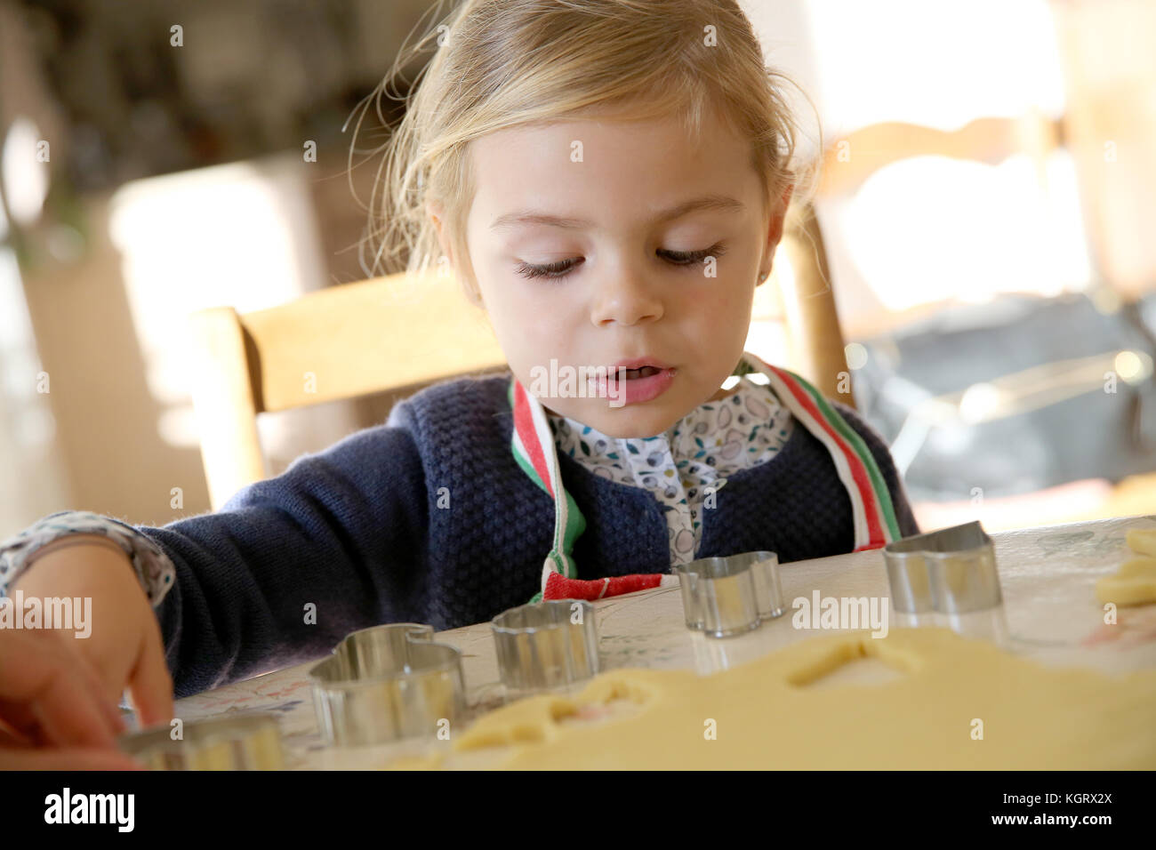 Cheerful little girl baking cookies Stock Photo - Alamy Cheerful little girl baking cookies Stock Photo - Alamy