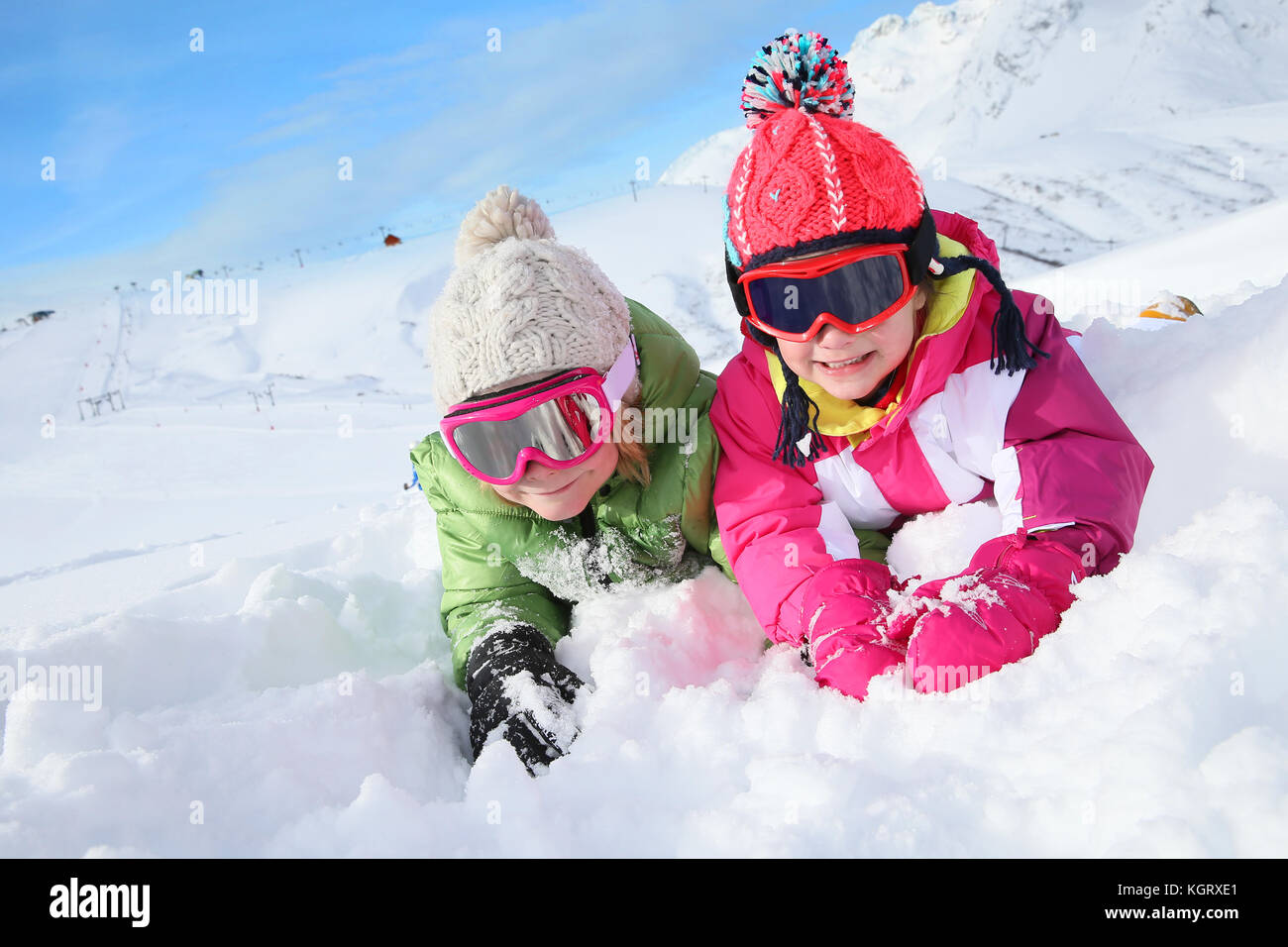 Kids enjoying snow vacation Stock Photo - Alamy
