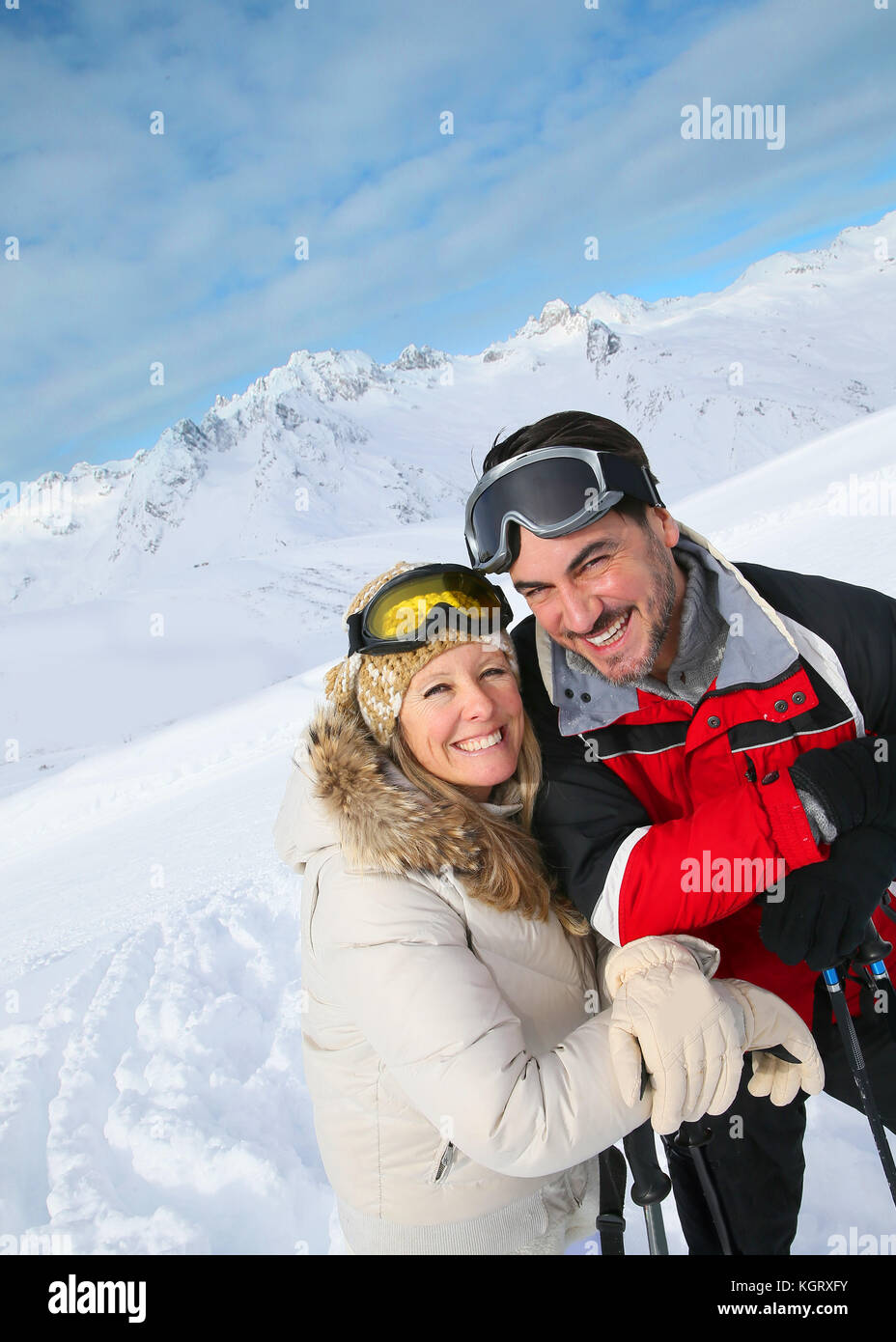 Couple of skiers enjoying winter vacation Stock Photo - Alamy