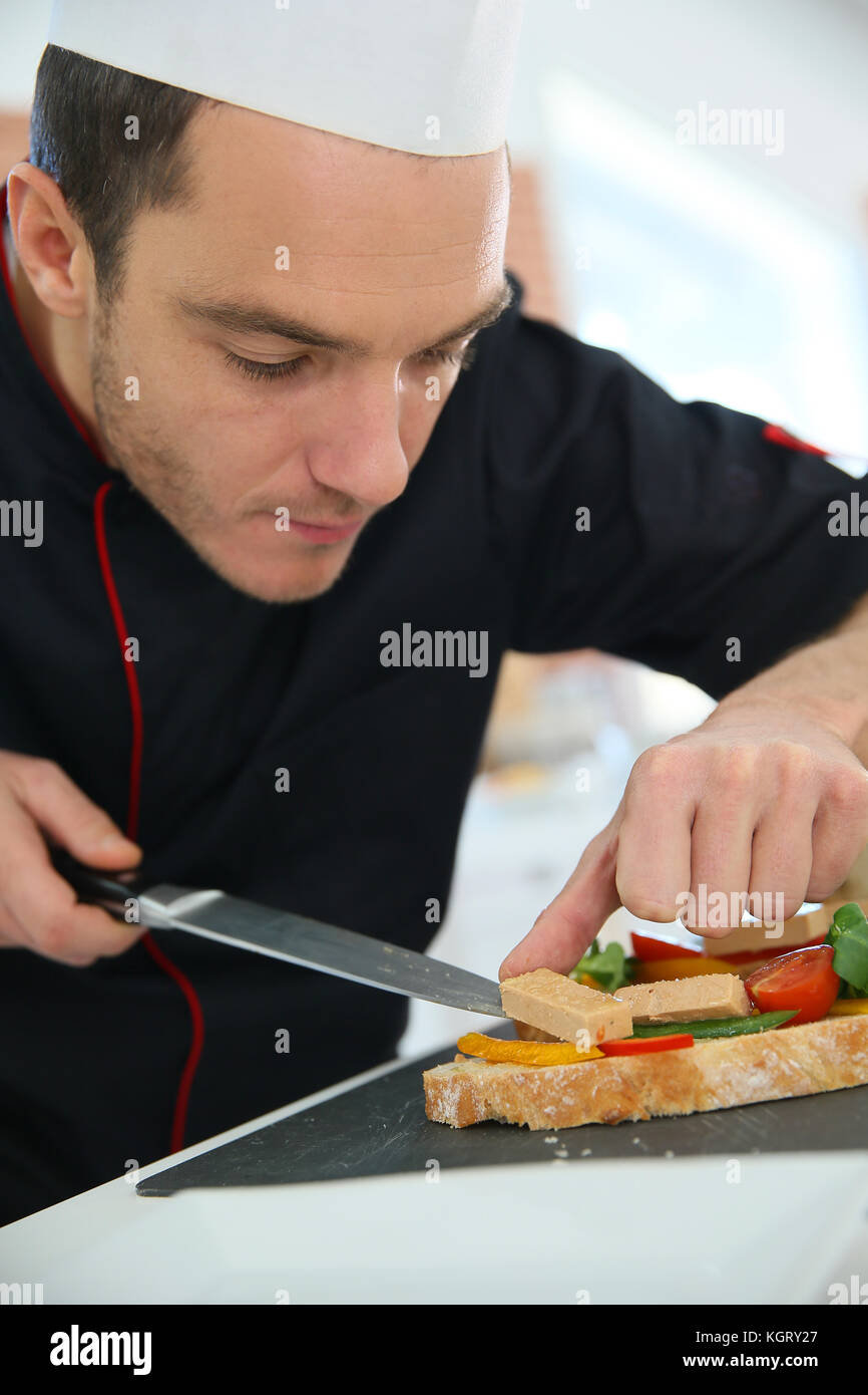 Chef preparing delicatessen disg Stock Photo - Alamy