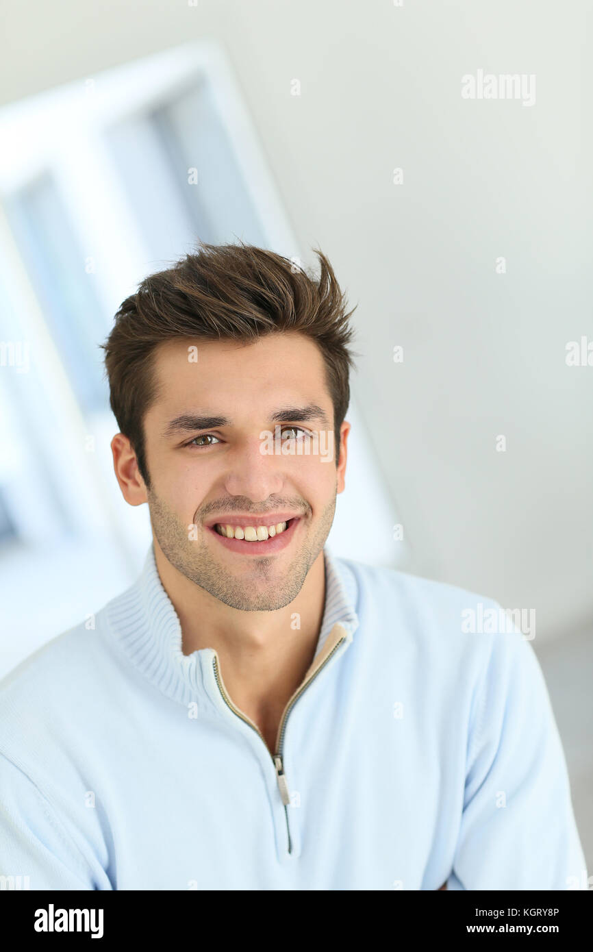 Portrait of young smiling man Stock Photo - Alamy