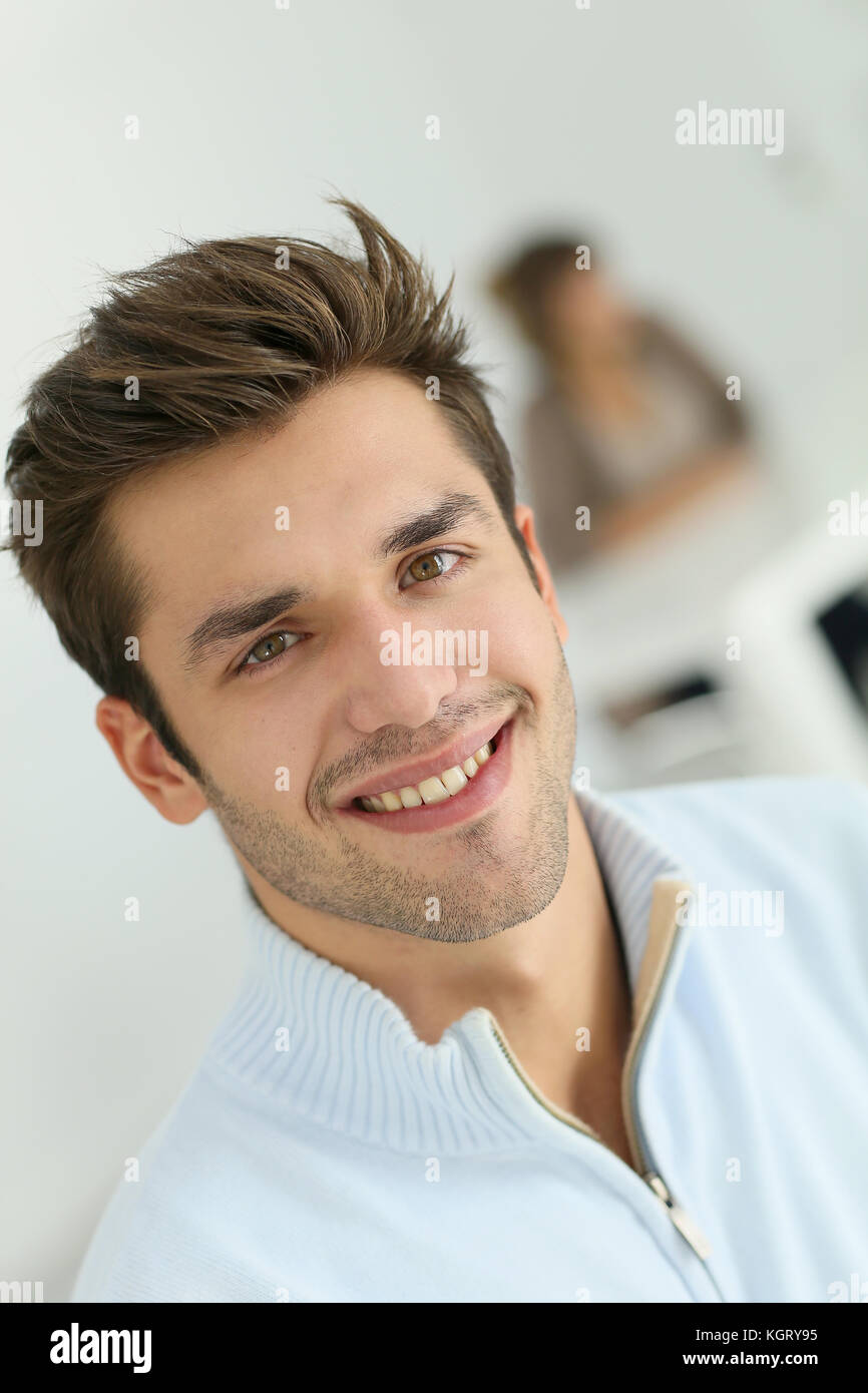 Portrait of young smiling man Stock Photo - Alamy