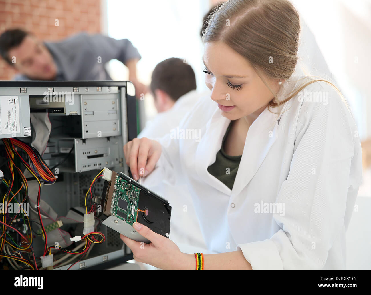 Student girl in technology fixing computer hard drive Stock Photo - Alamy